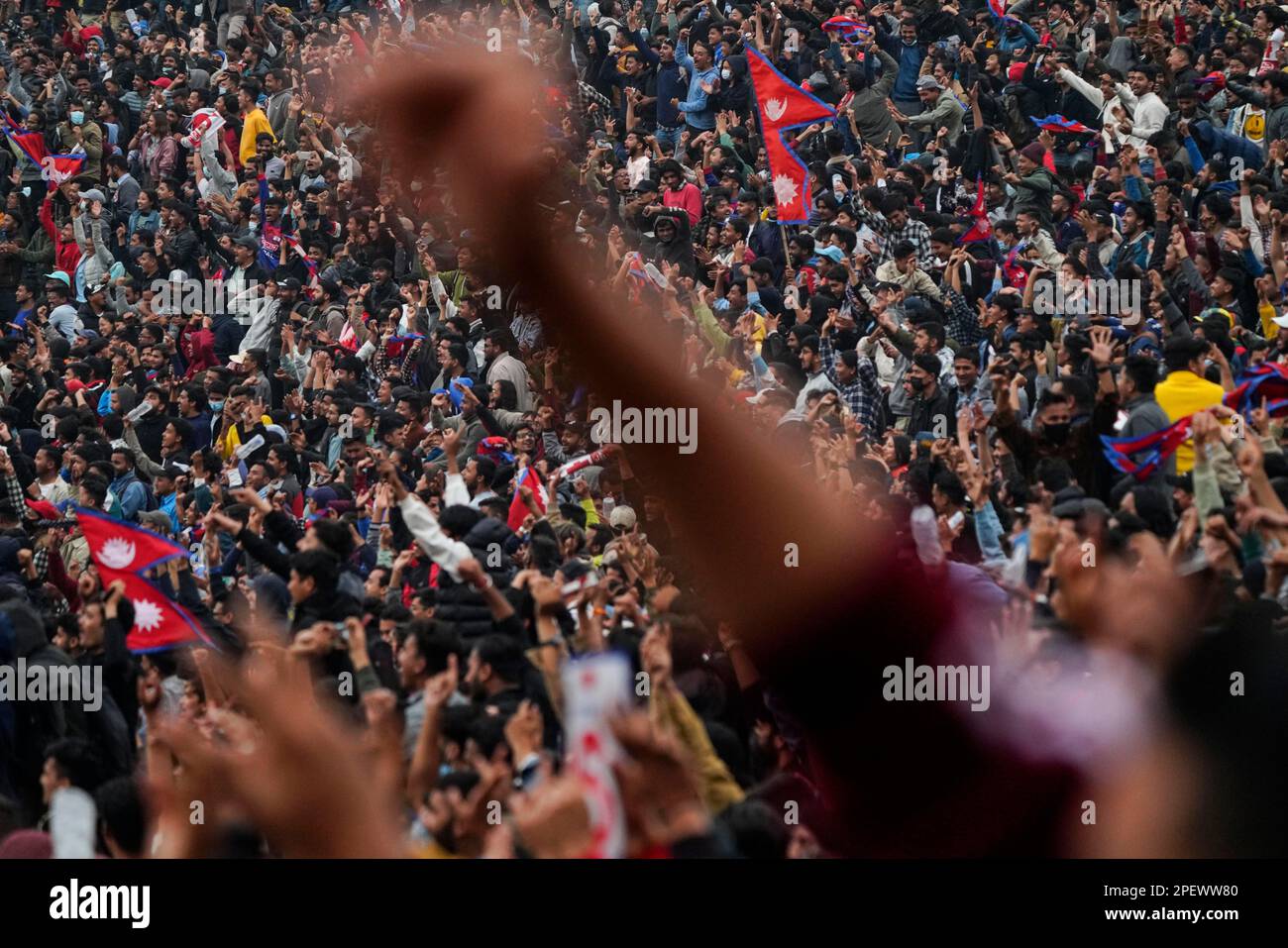 Kirtipur, Nepal. 16th Mar, 2023. Nepali fans cheer during the cricket ...