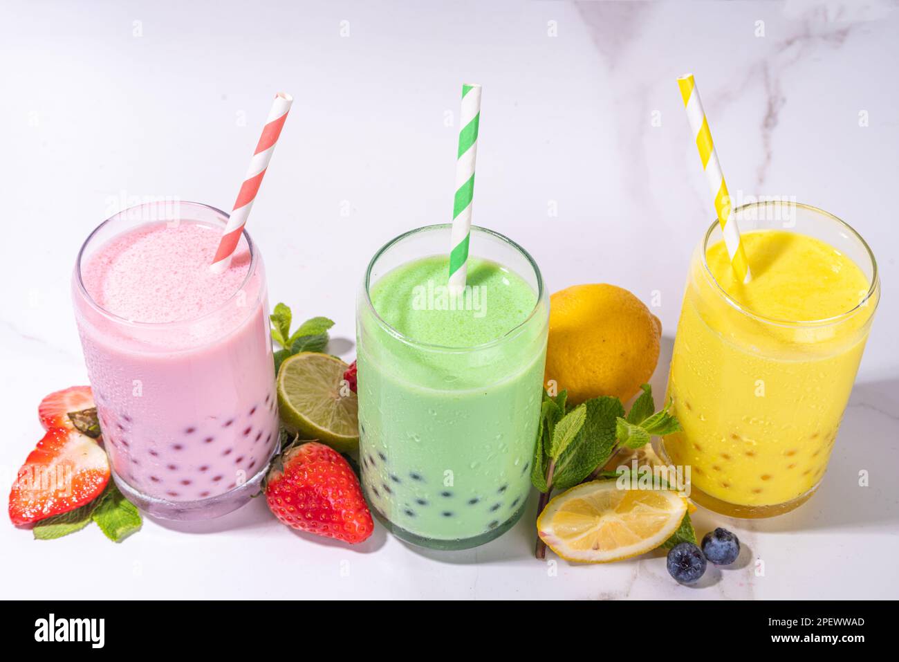 Set of three colorful summer bubble tea, bright creamy pearl tea or ...