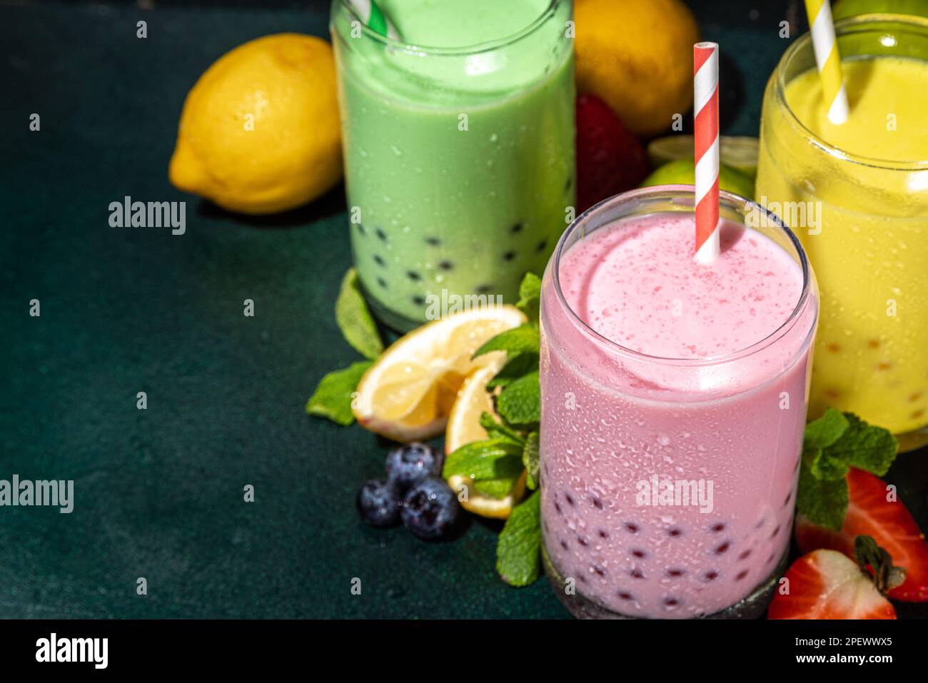 Set of three colorful summer bubble tea, bright creamy pearl tea or ...