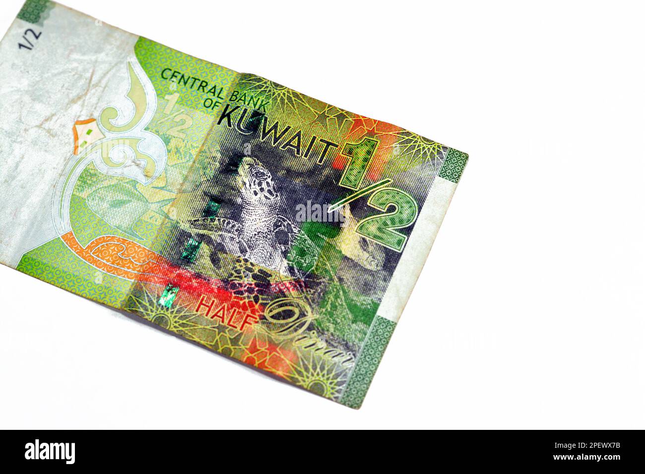 The reverse side of Kuwaiti half dinar green paper banknote cash money ...