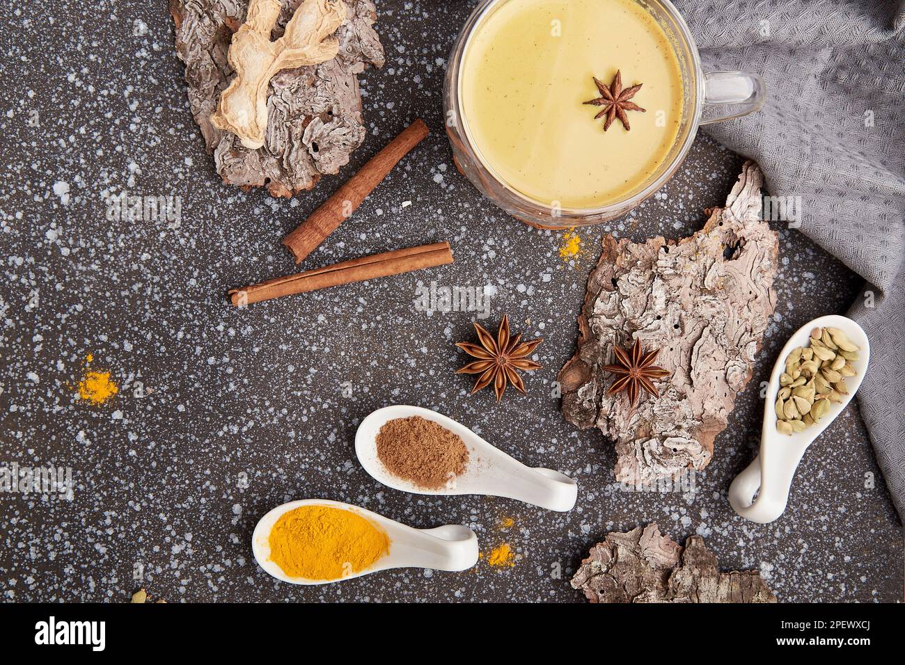 Organic natural masala tea with star anise, cinnamon, turmeric on tree ...