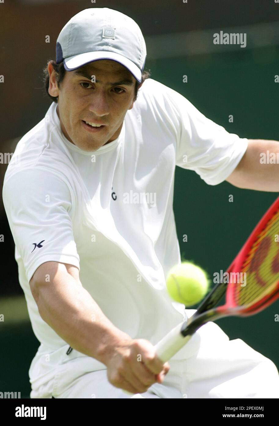 Argentina's Guillermo Canas plays a return to Todd Martin of the U.S ...
