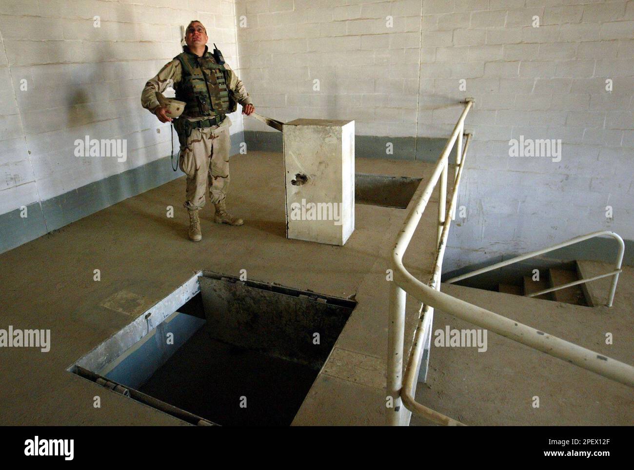 U.S. Army military police Maj. Gary Link grasps the hangman's lever ...