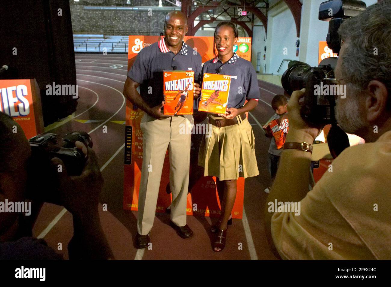 Olympic track and field gold medalists Carl Lewis, left, and Jackie ...