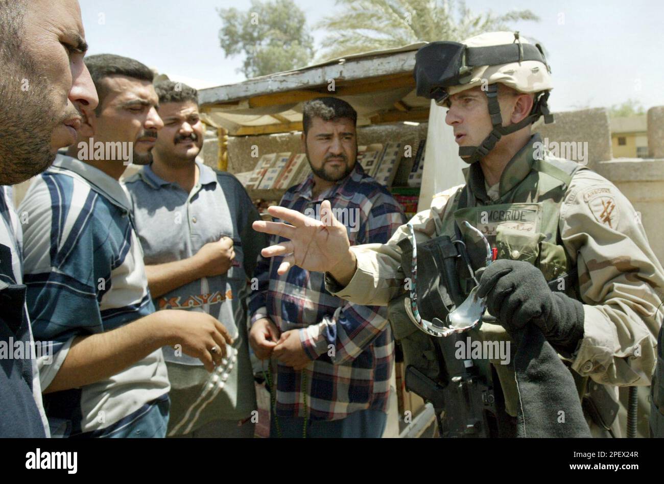 U.S. Army Capt. Paul McBride, of San Diego, California, right, orders ...
