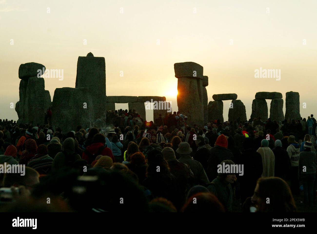 Revellers watch the sun rise during the Summer Solstice ceremonies at ...
