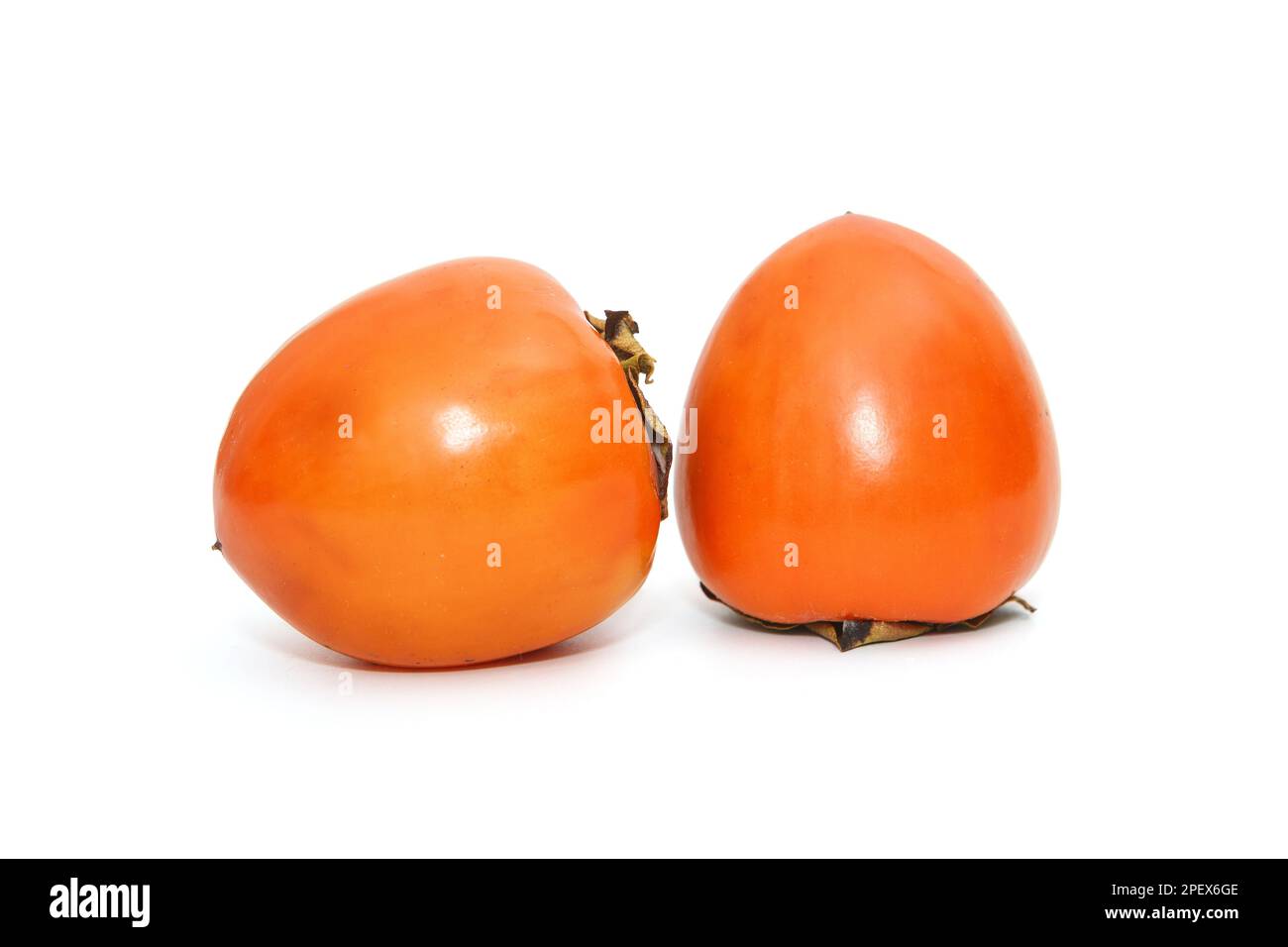 Two ripe persimmons isolated on a white background Stock Photo - Alamy