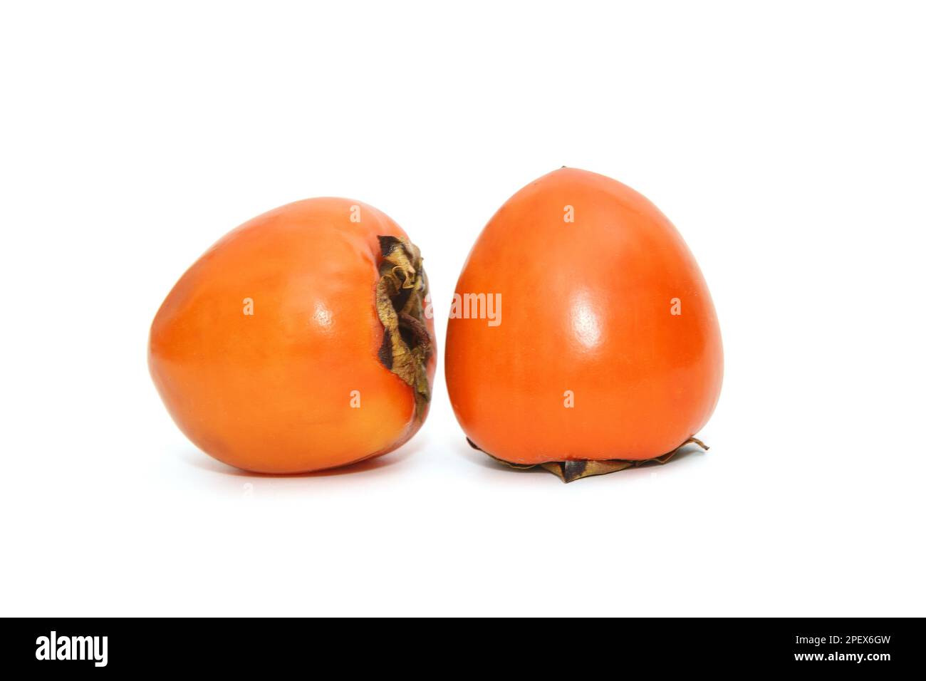 Two ripe persimmons isolated on a white background Stock Photo - Alamy