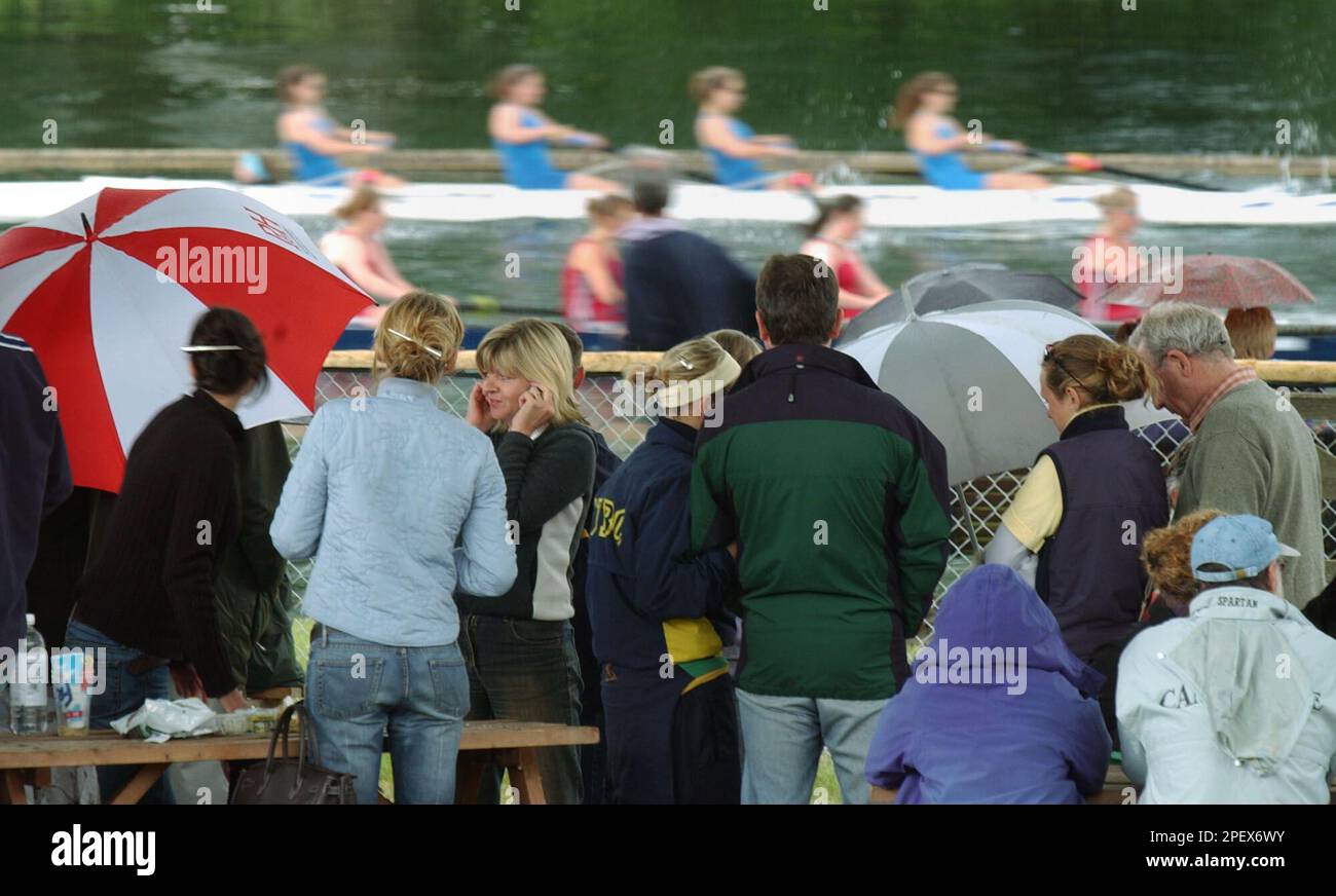 Spectators shelter from the rain during one of the races at the Henley ...