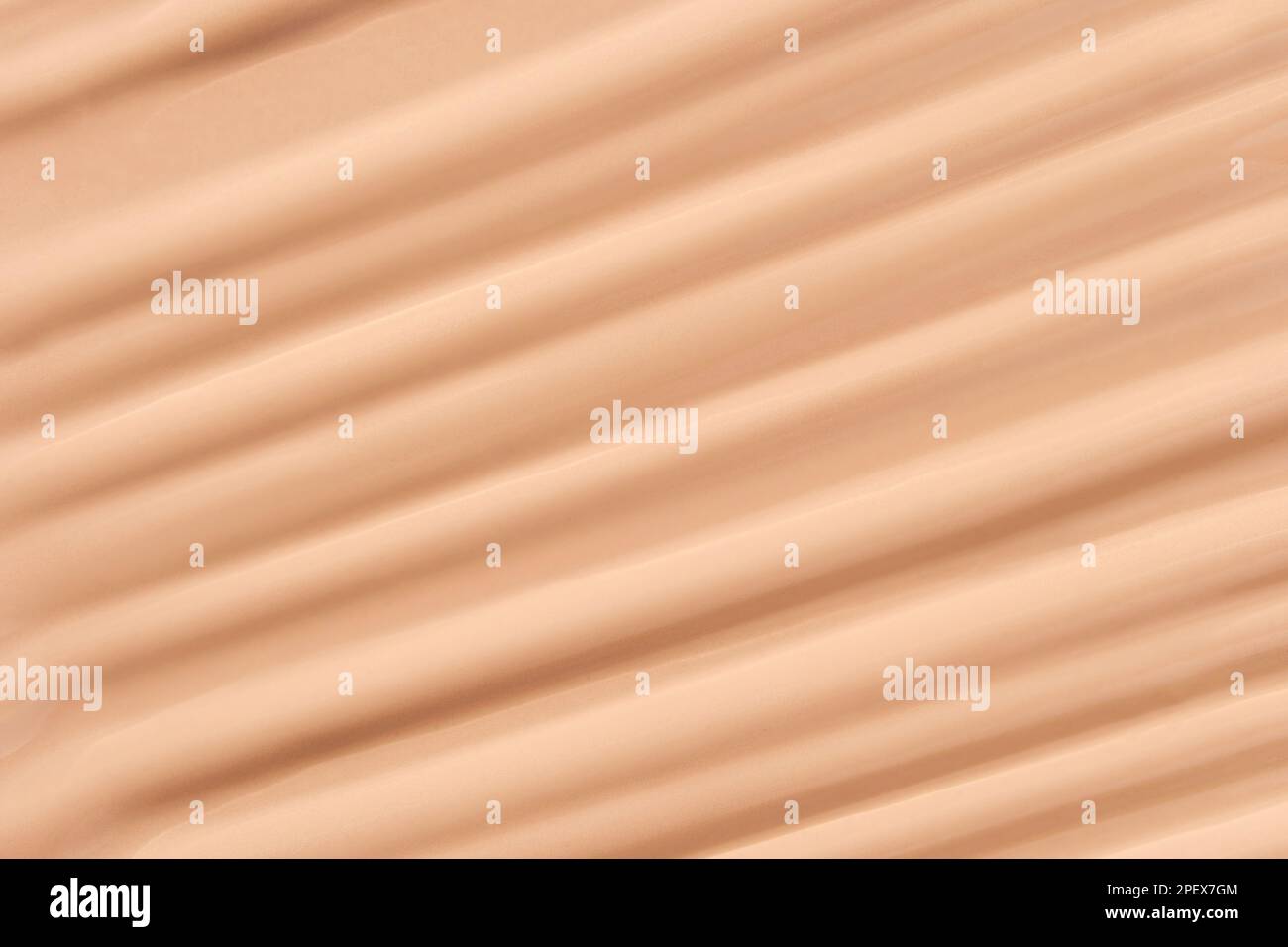 Cosmetic brown base product background. Beige paste texture. Powder ...