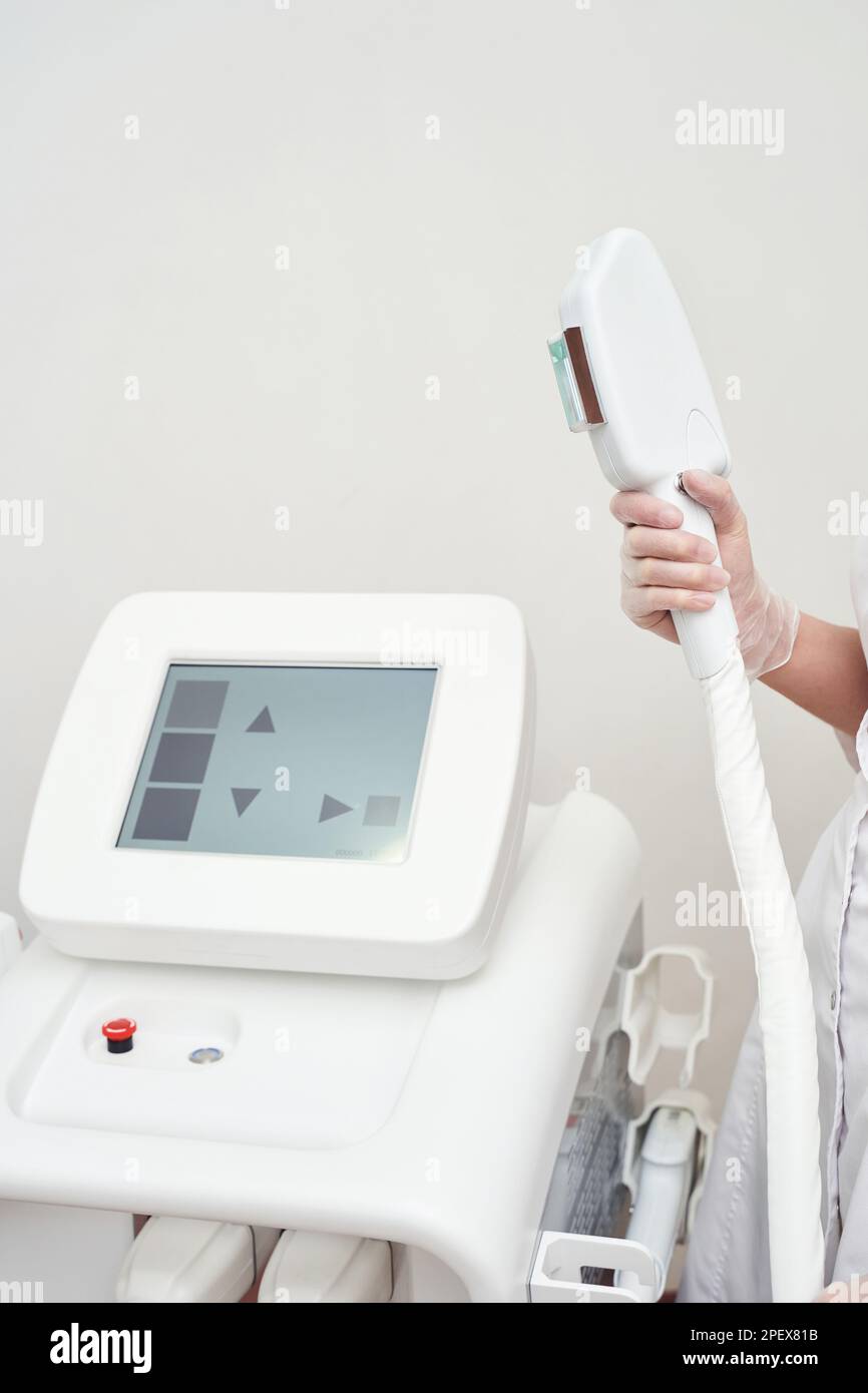 Laser hair removal treatment. Doctor holding. Clinic skin care ...