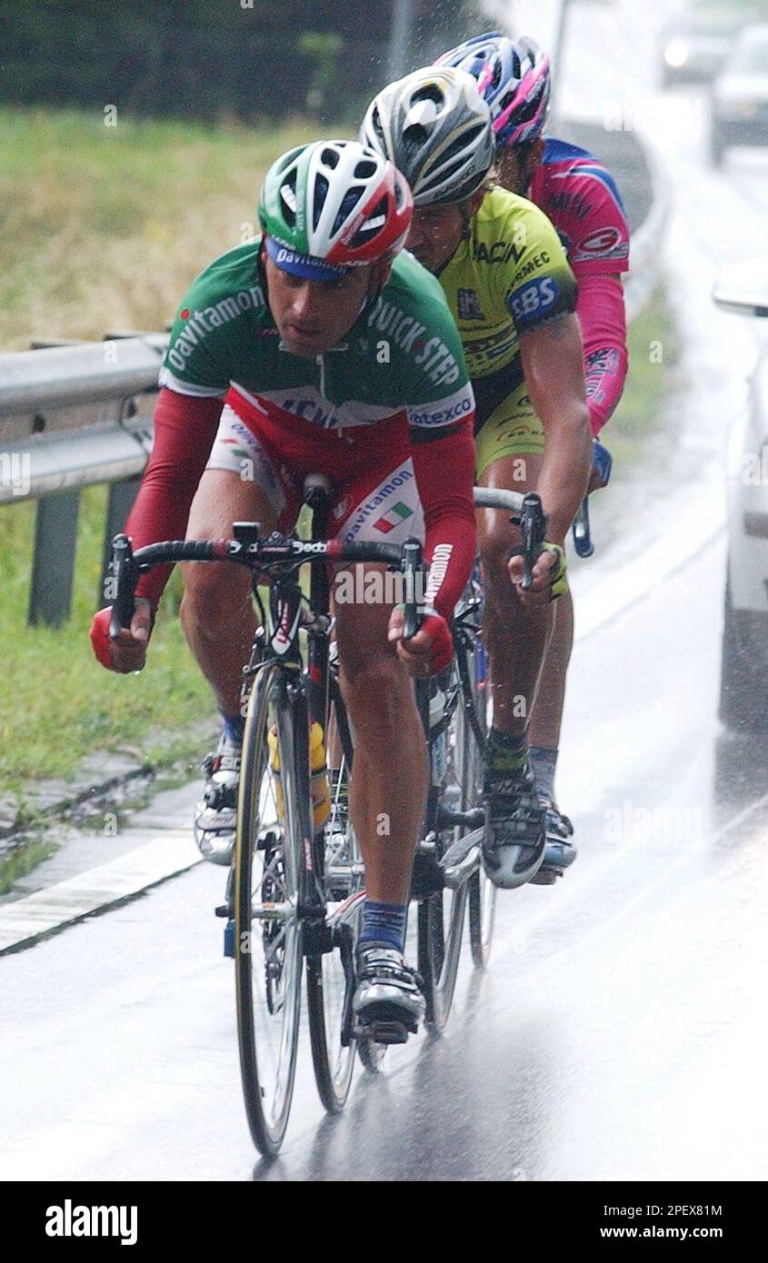 Paolo Bettini, left, from Italy, Patrick Calcagni, centre, from ...