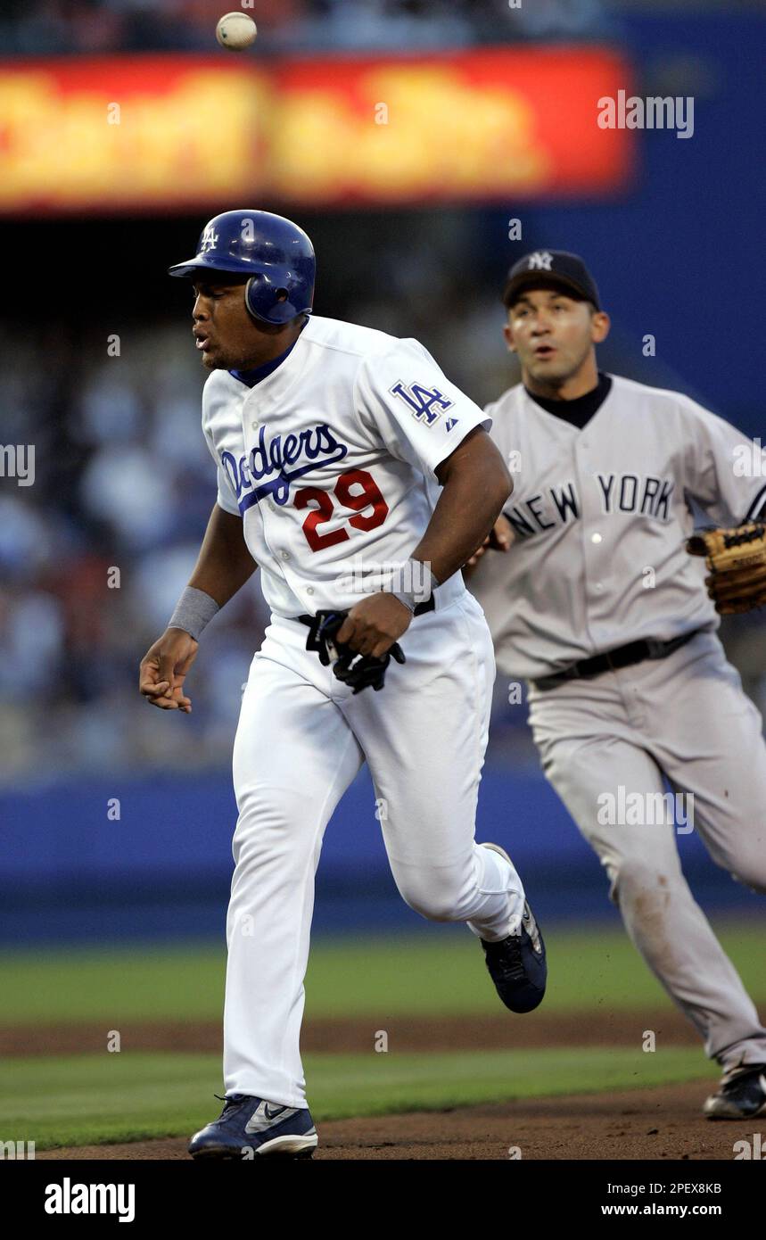 Los Angeles Dodgers Adrian Beltre, left, is caught in a rundown between first and second base as ...