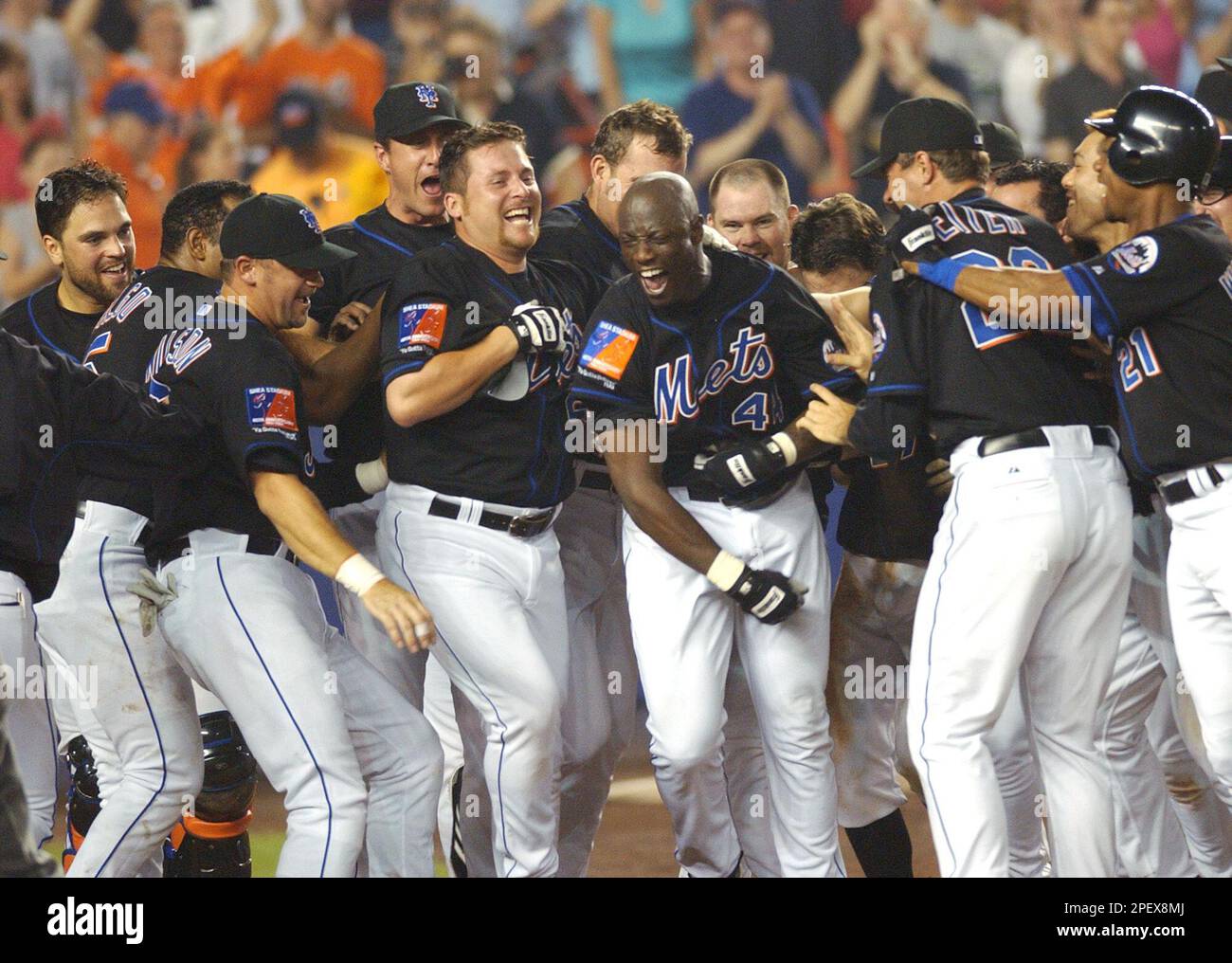 New York Mets' Mike Cameron, center is surrounded by teammates as he ...