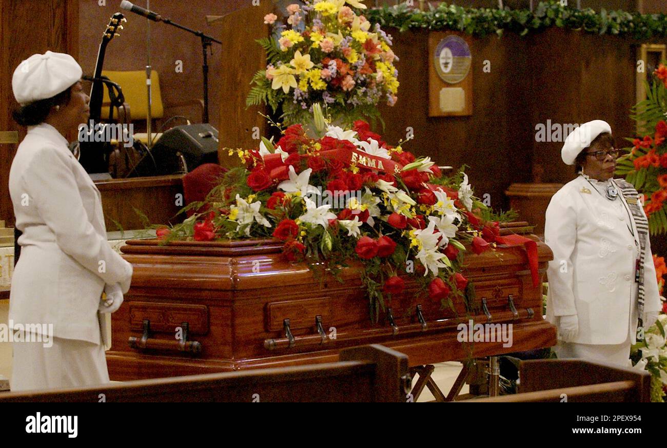 Matrons from the church stand by the casket of music legend Ray Charles ...