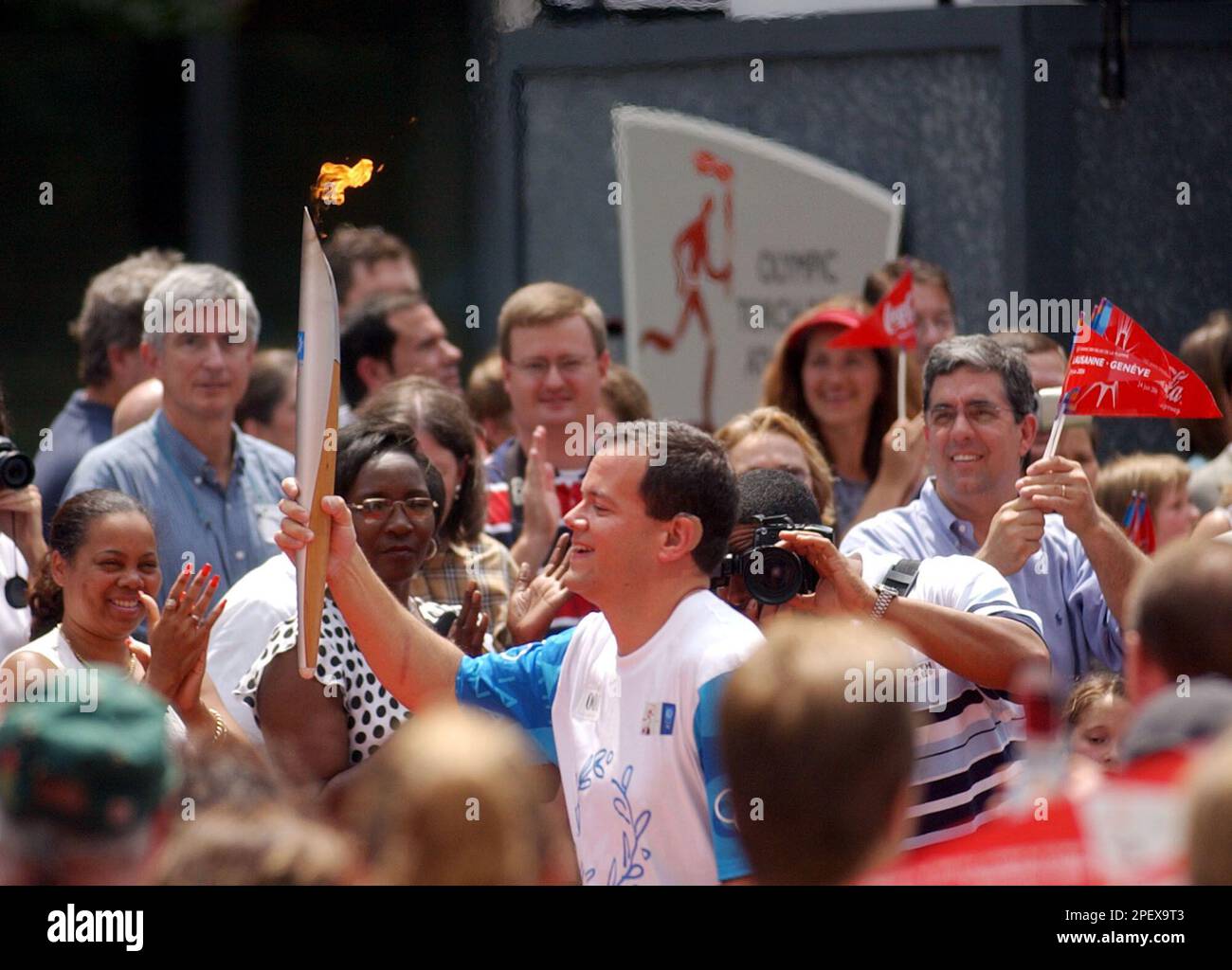 Rafael San Miguel carries the Olympic Flame to begin the Atlanta leg of ...