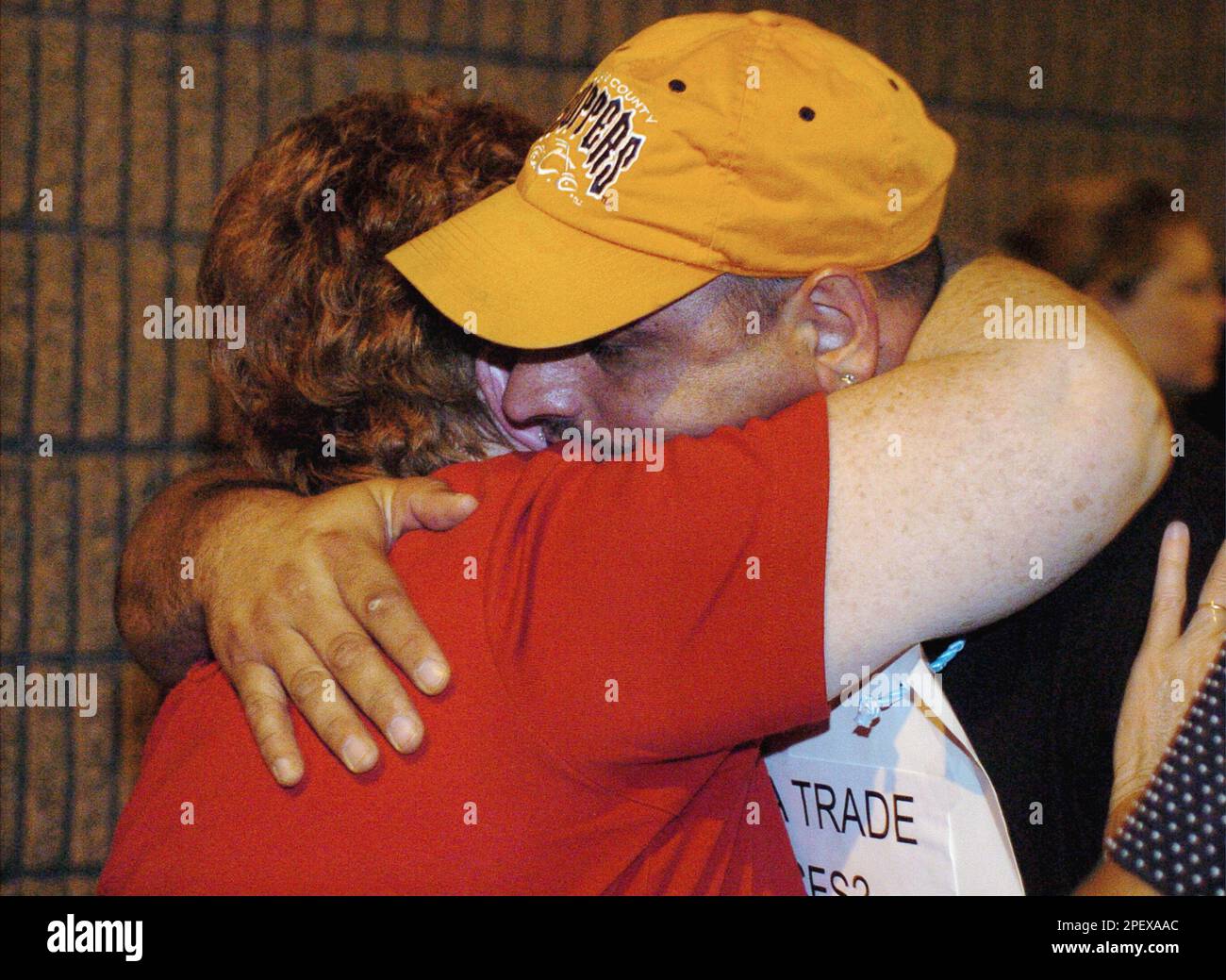 Betty Romano and her son Fred A. Romano hug outside a prison complex in ...