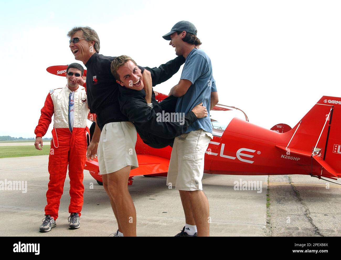 Aerobatics pilot Sean D. Tucker, second from left, and his son Eric ...