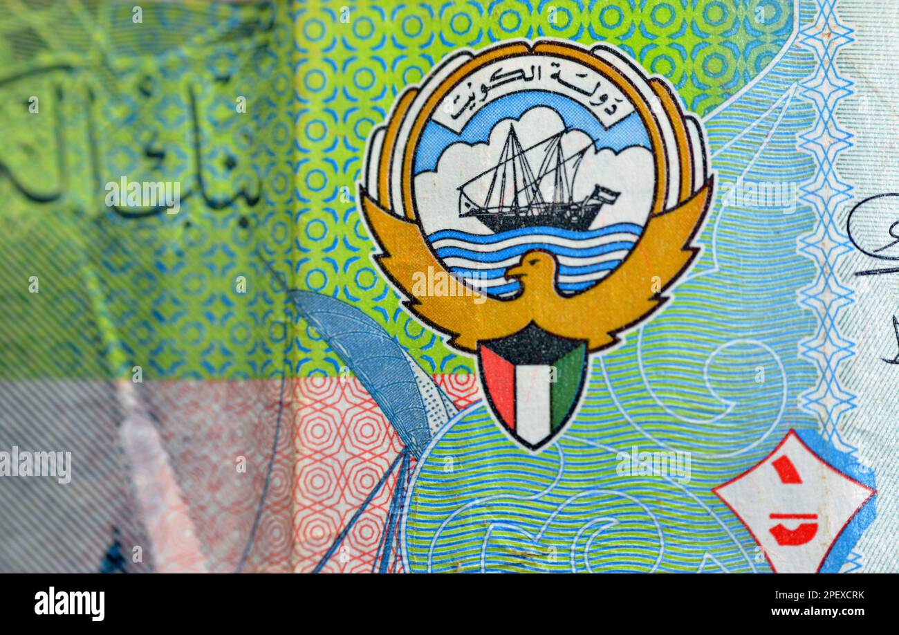 The coat of arms and flag of Kuwait closeup from the obverse side of ...