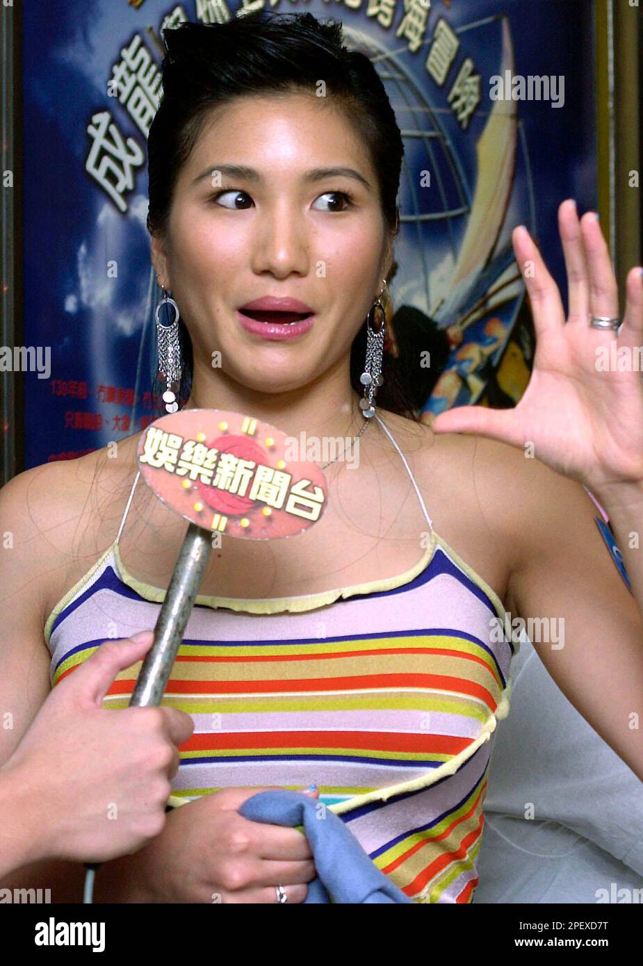 Hong Kong actress Marsha Yuen speaks to a reporter at the Hong Kong premiere of the Hollywood ...