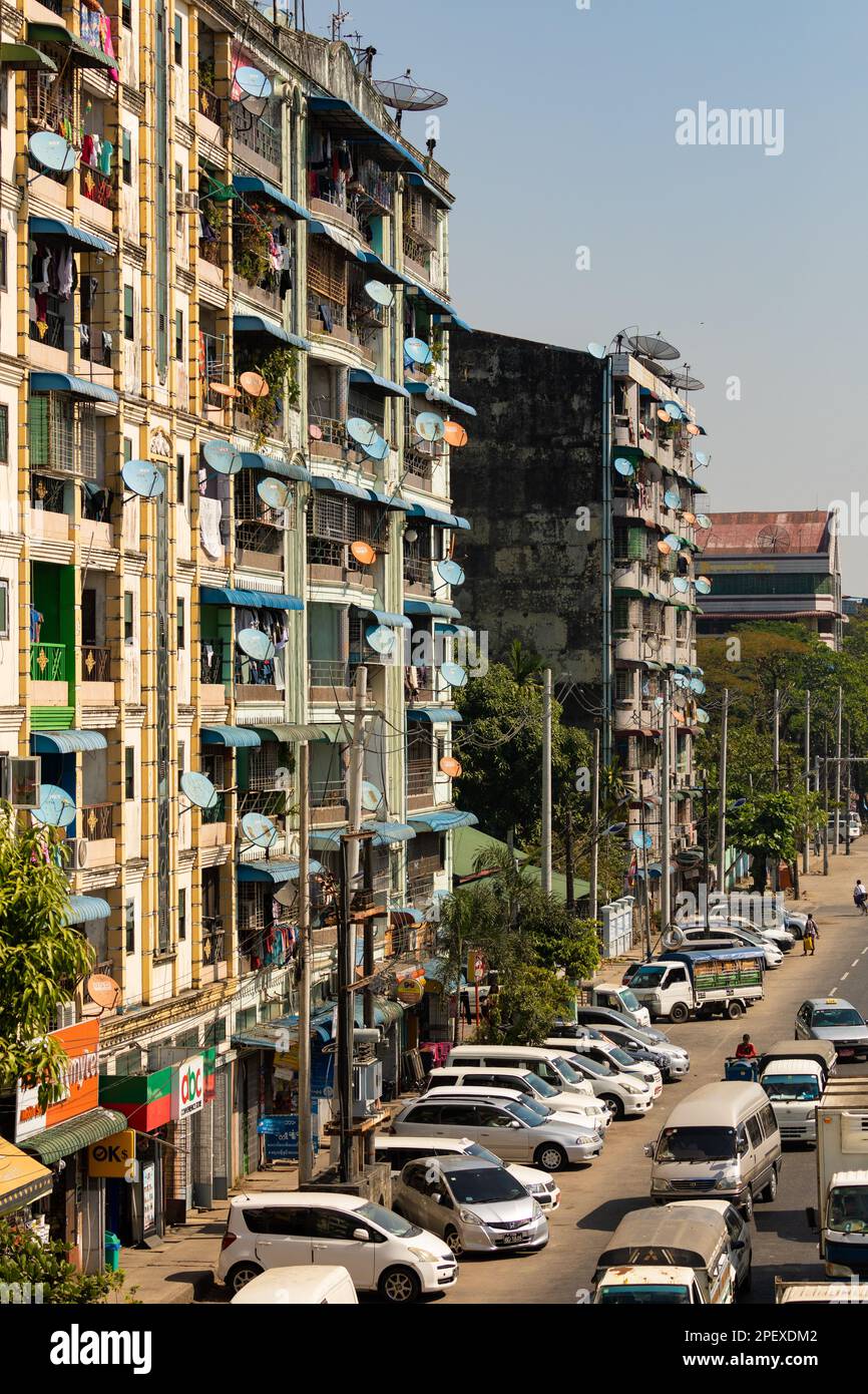 Yangon, Myanmar - Dec 19, 2019: Rundown block of apartments with a ...