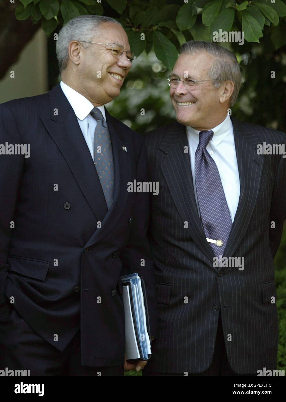 Secretary of State Collin Powell, left, and Secretary of Defense ...