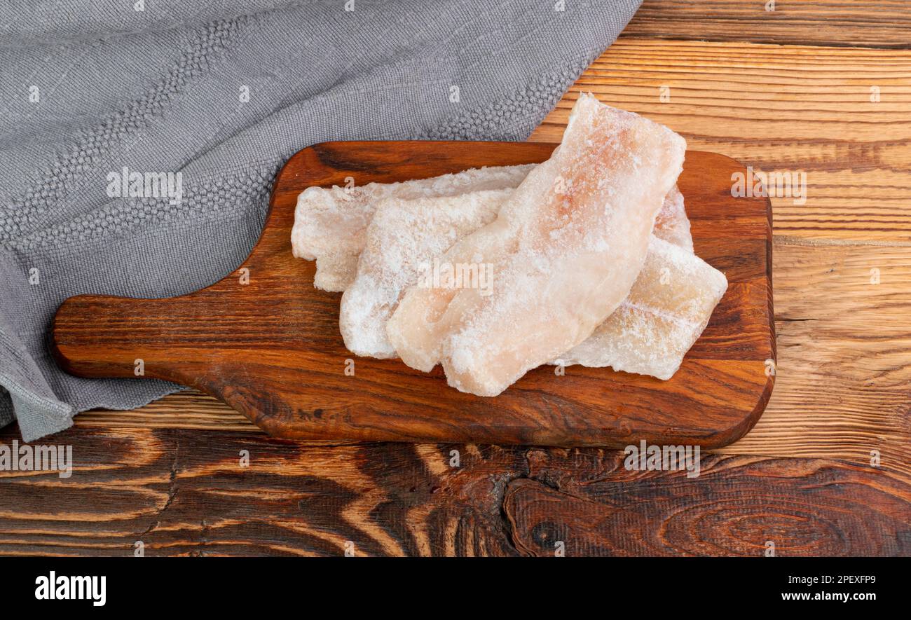 Frozen Fish on Wooden Cutting Board, White Cod Fillet, Iced Hake Filet ...