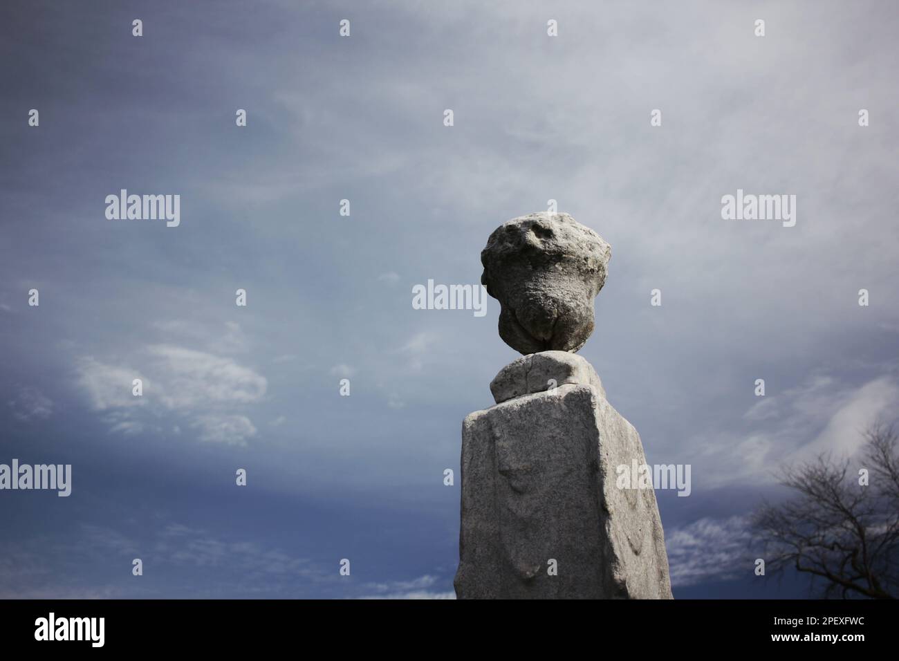 A heavily weathered and worn old stone tower standing tall against the ...