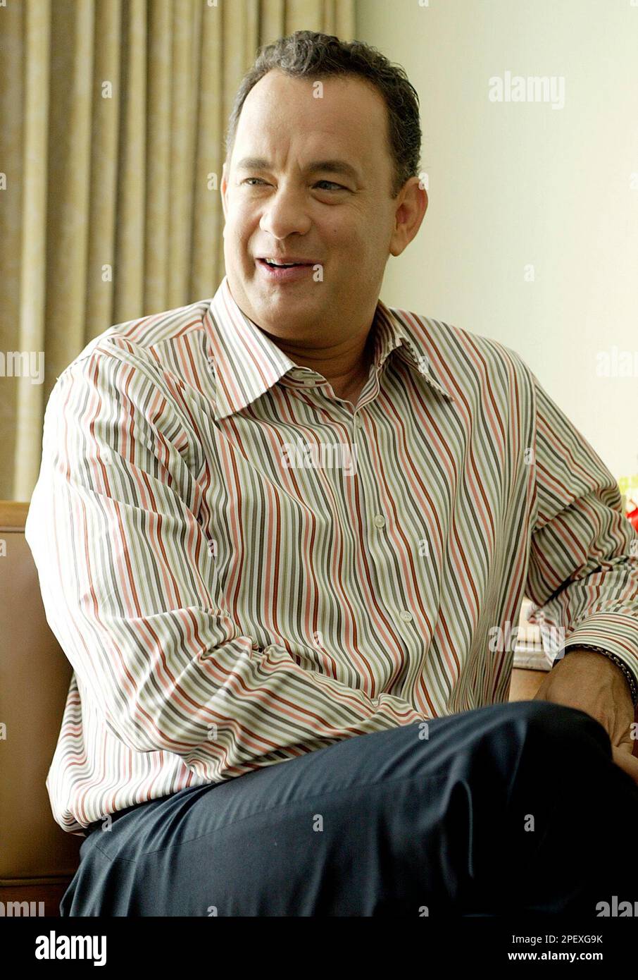 Actor Tom Hanks laughs during an interview with an Associated Press ...