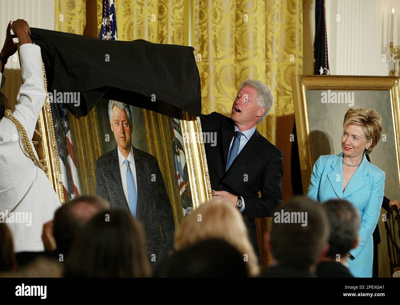 Former President Clinton, center, unveils his portrait as he and former ...