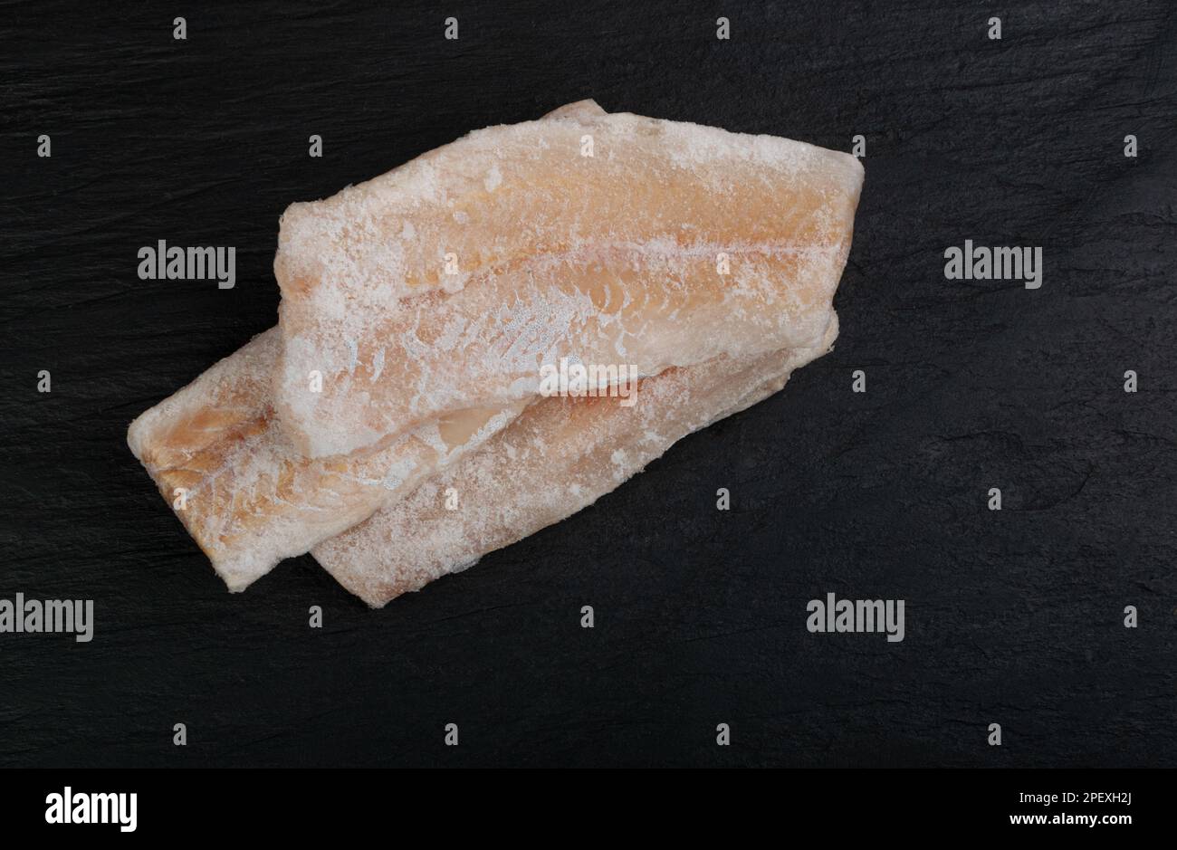 Frozen Fish on Black Plate, White Cod Fillet, Iced Hake Filet, Frozen ...