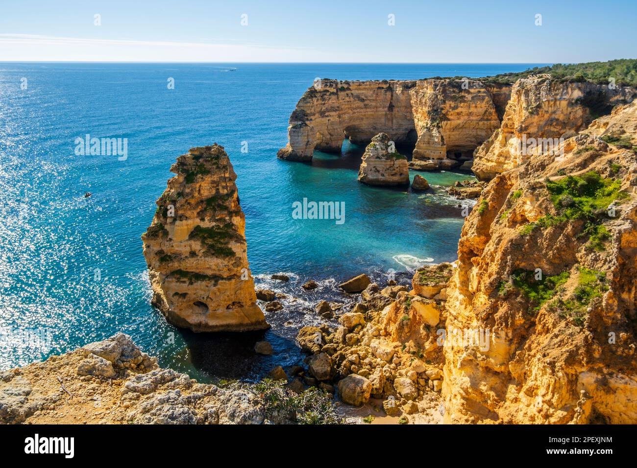 Beautiful cliffs and rock formations by the Atlantic Ocean at Marinha ...