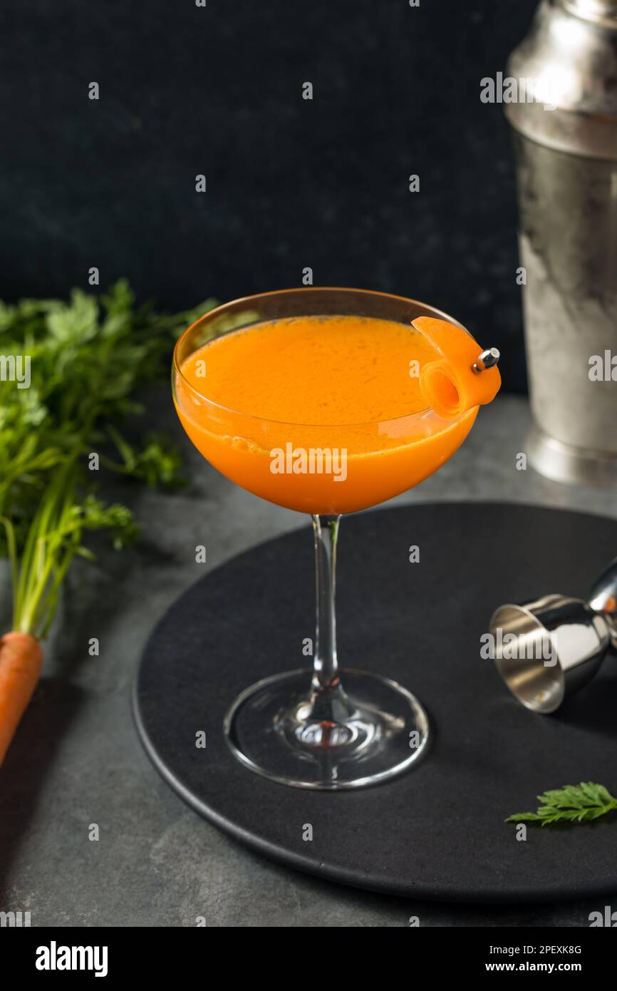Boozy Healthy Carrot Bourbon Cocktail with Lemon Stock Photo - Alamy