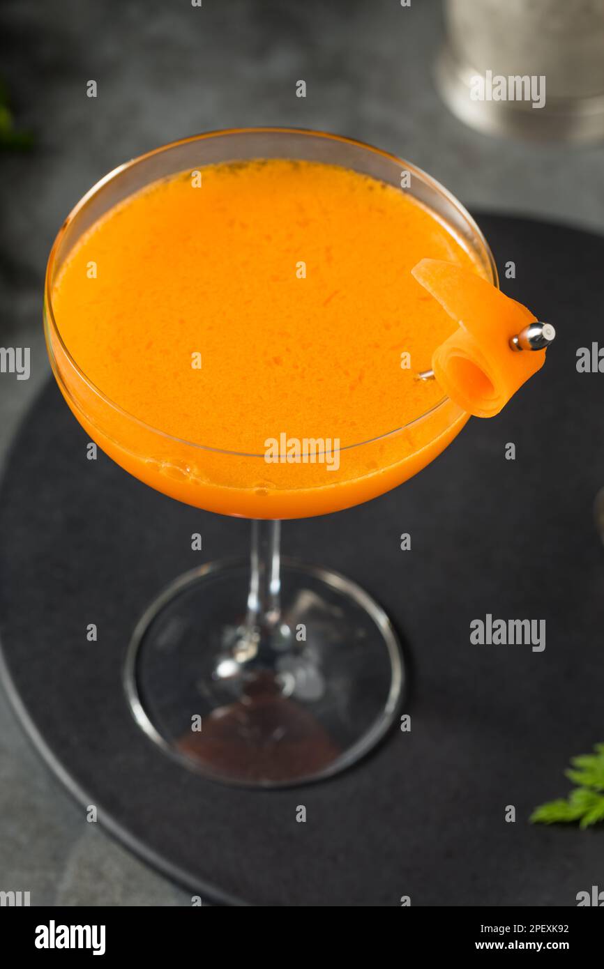 Boozy Healthy Carrot Bourbon Cocktail with Lemon Stock Photo - Alamy