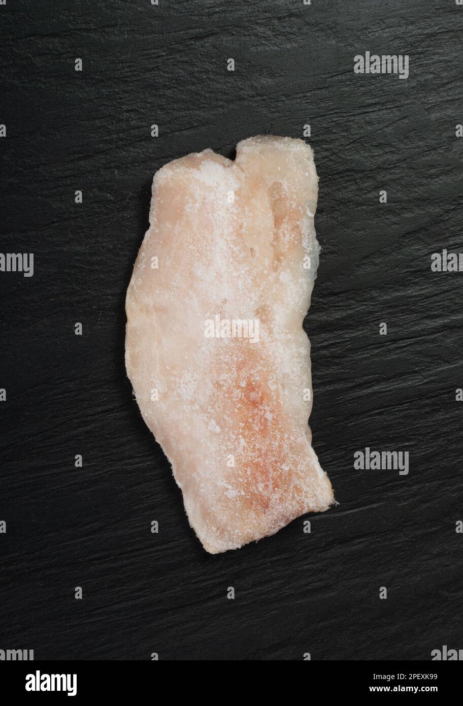Frozen Fish on Black Plate, White Cod Fillet, Iced Hake Filet, Frozen ...