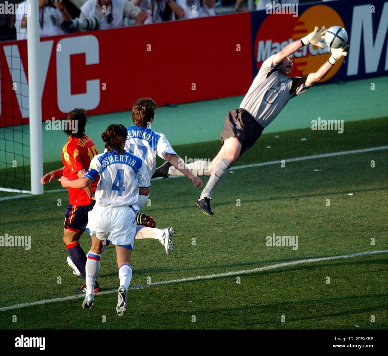 Russia's goalie Sergey Ovchinnikov, right, saves the ball in the Euro ...