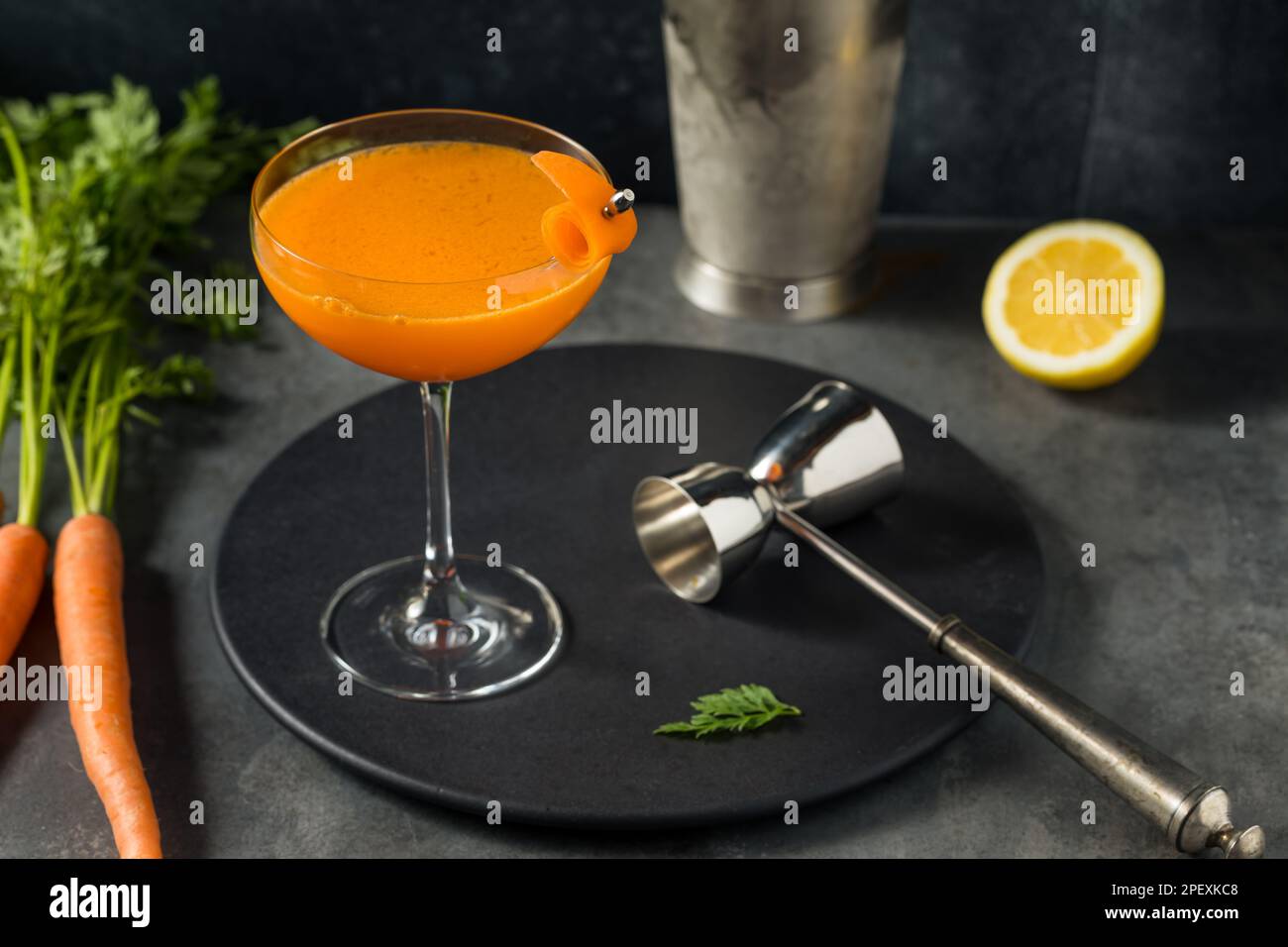 Boozy Healthy Carrot Bourbon Cocktail with Lemon Stock Photo - Alamy