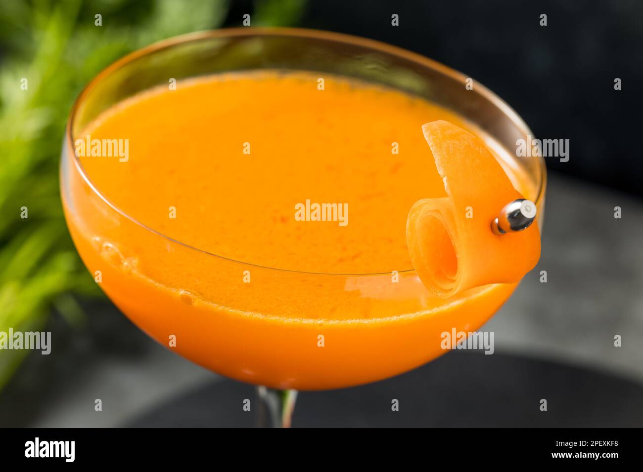 Boozy Healthy Carrot Bourbon Cocktail with Lemon Stock Photo - Alamy