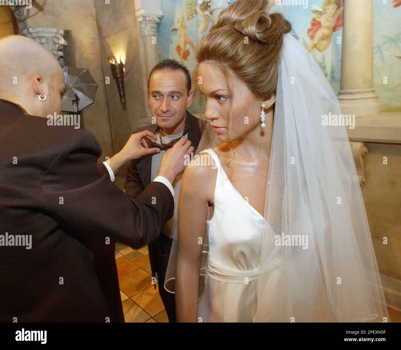 Anthony Stallone, center, of Seaford, N.Y., is assisted by Manny Matos ...