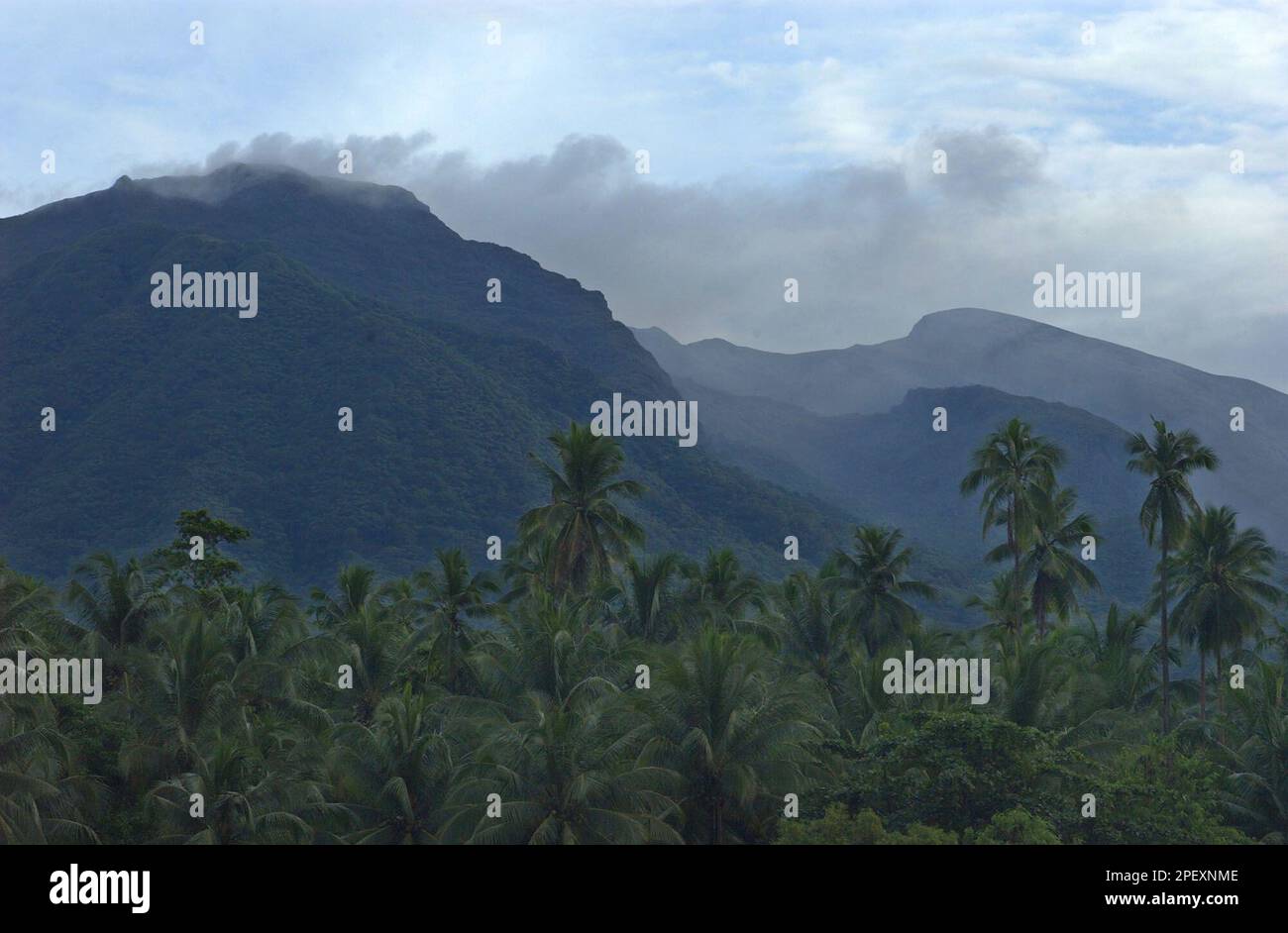 Ash continues to rise from Mount Awu, Friday, June 11, 2004, following ...