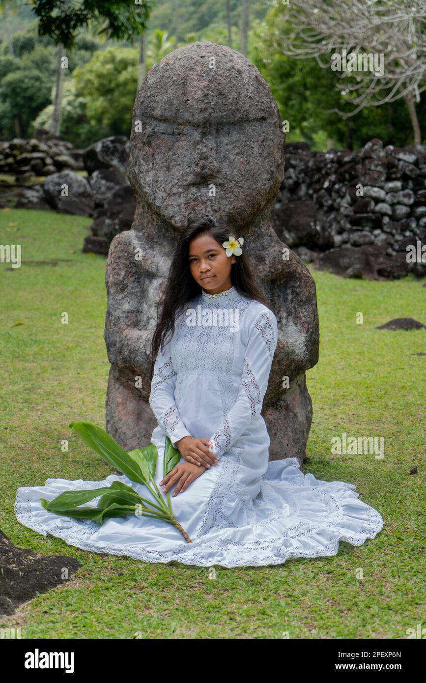 Tahitian woman in Missionary Dress with Tiki Stock Photo - Alamy