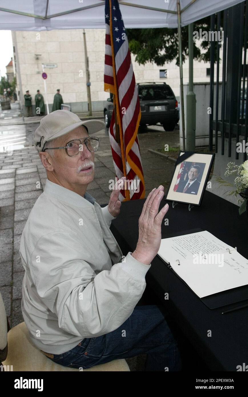 Berlin citizen Richard Brose signs a condolence book in remembrance of ...