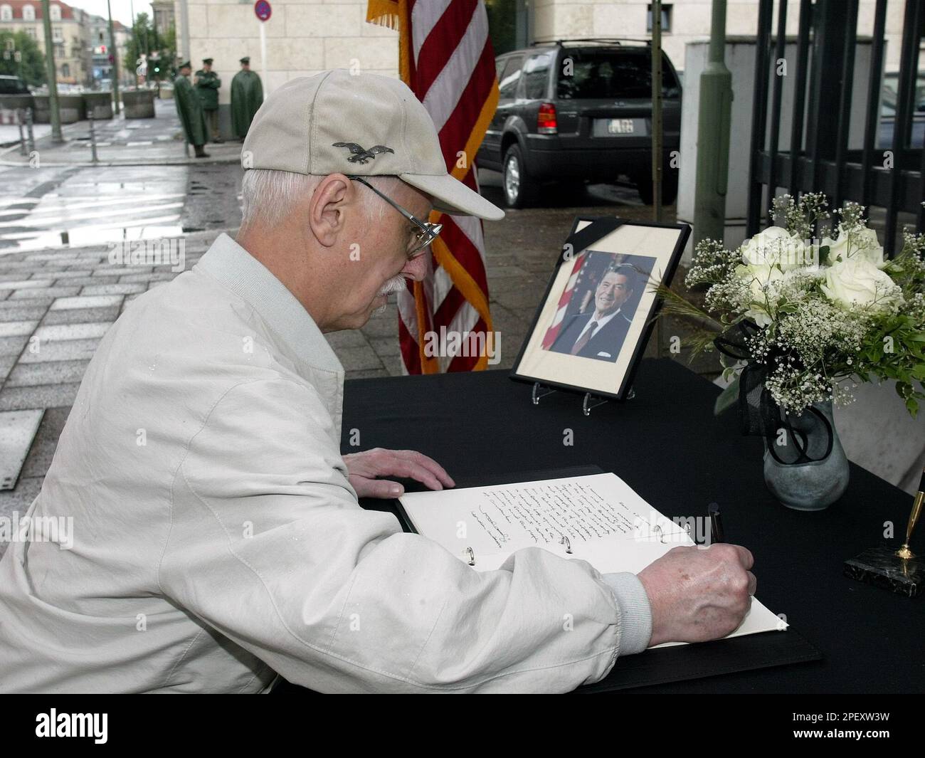 Berlin citizen Richard Brose signs a condolence book in remembrance of ...