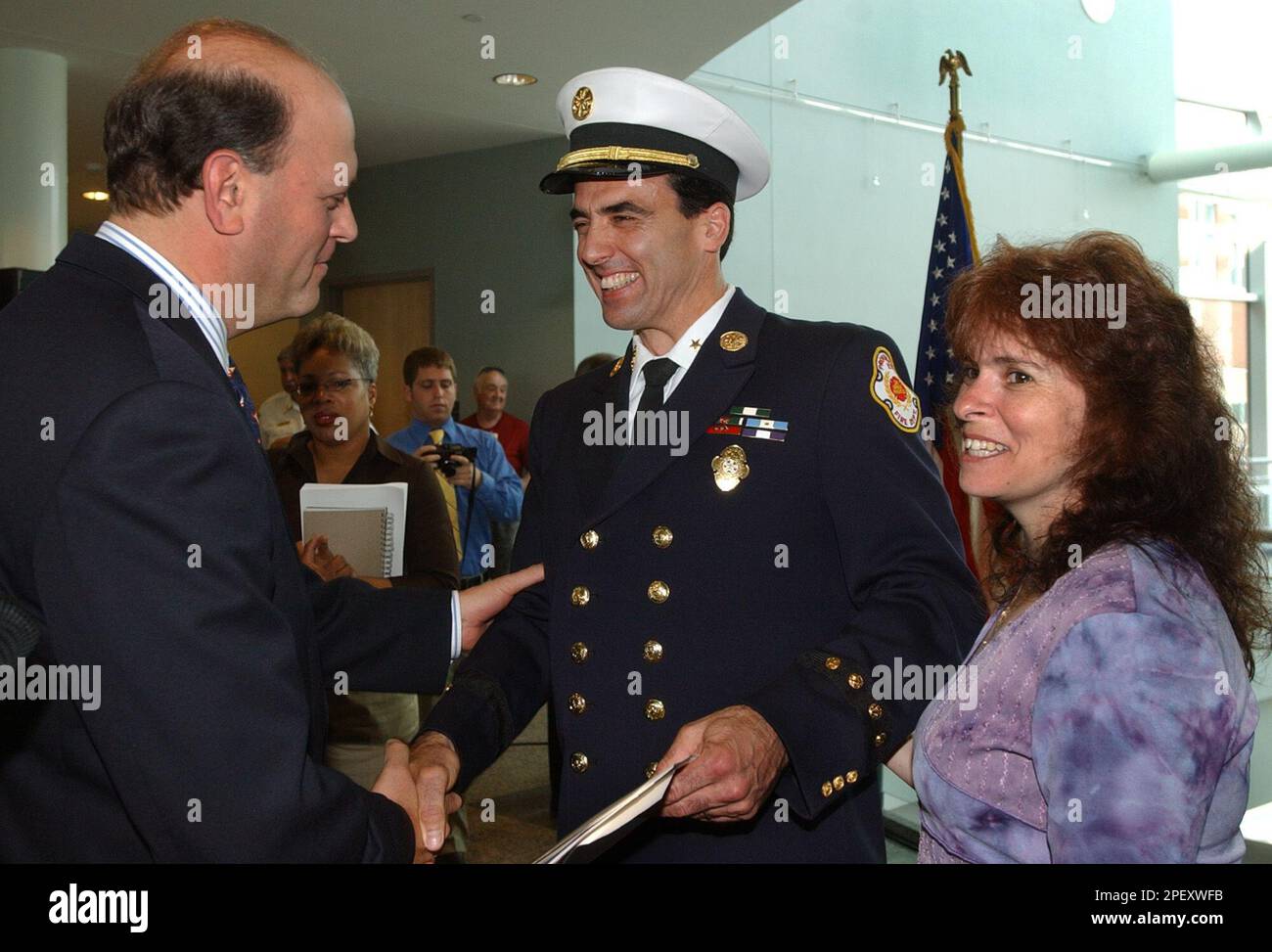 Providence, R.I. Police Chief Col. Dean Esserman, left, congratulates ...