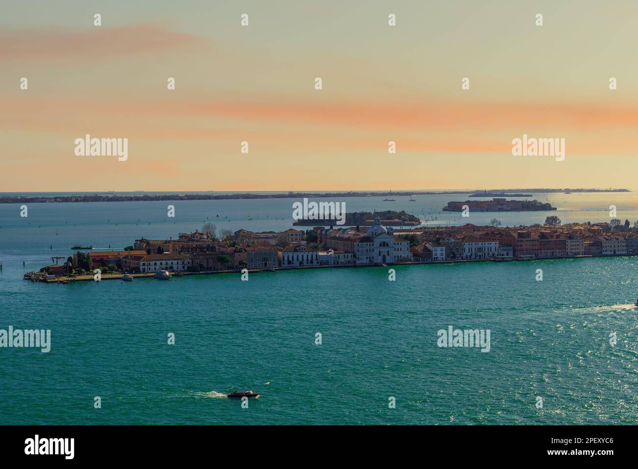 Venice, Italy evening view of pink sunset clouds above traditional low ...