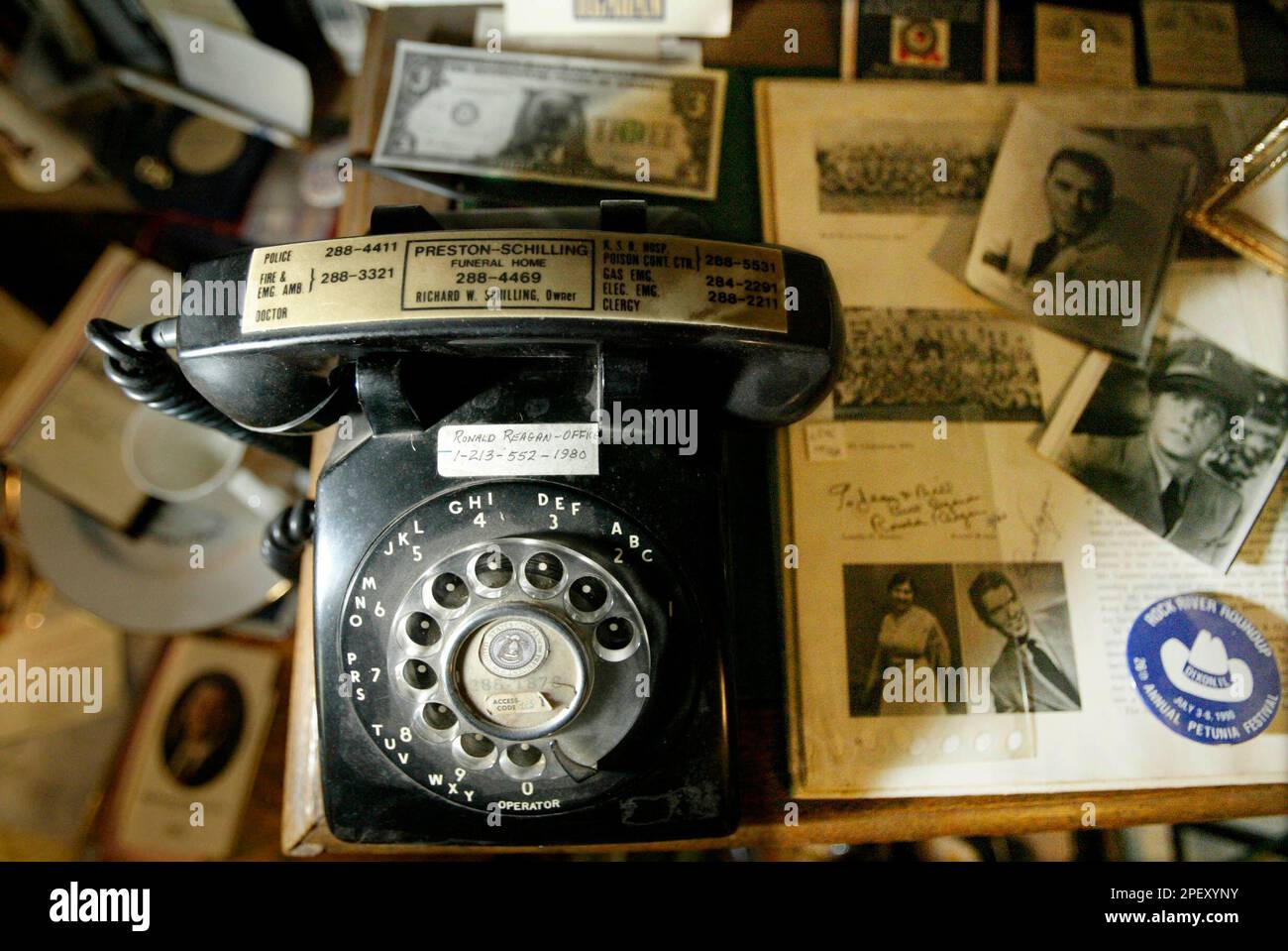 A phone at Bill Thompson's Dixon, Ill. home sits on a table among ...