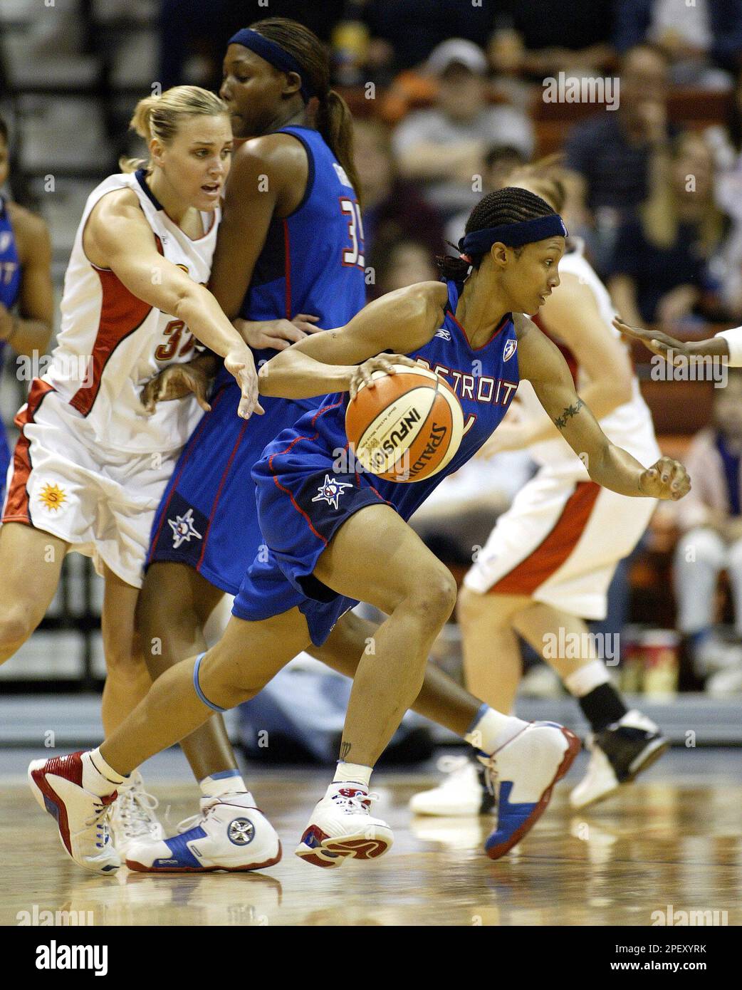 Detroit Shock's Deanna Nolan, right, drives around a pick set by ...