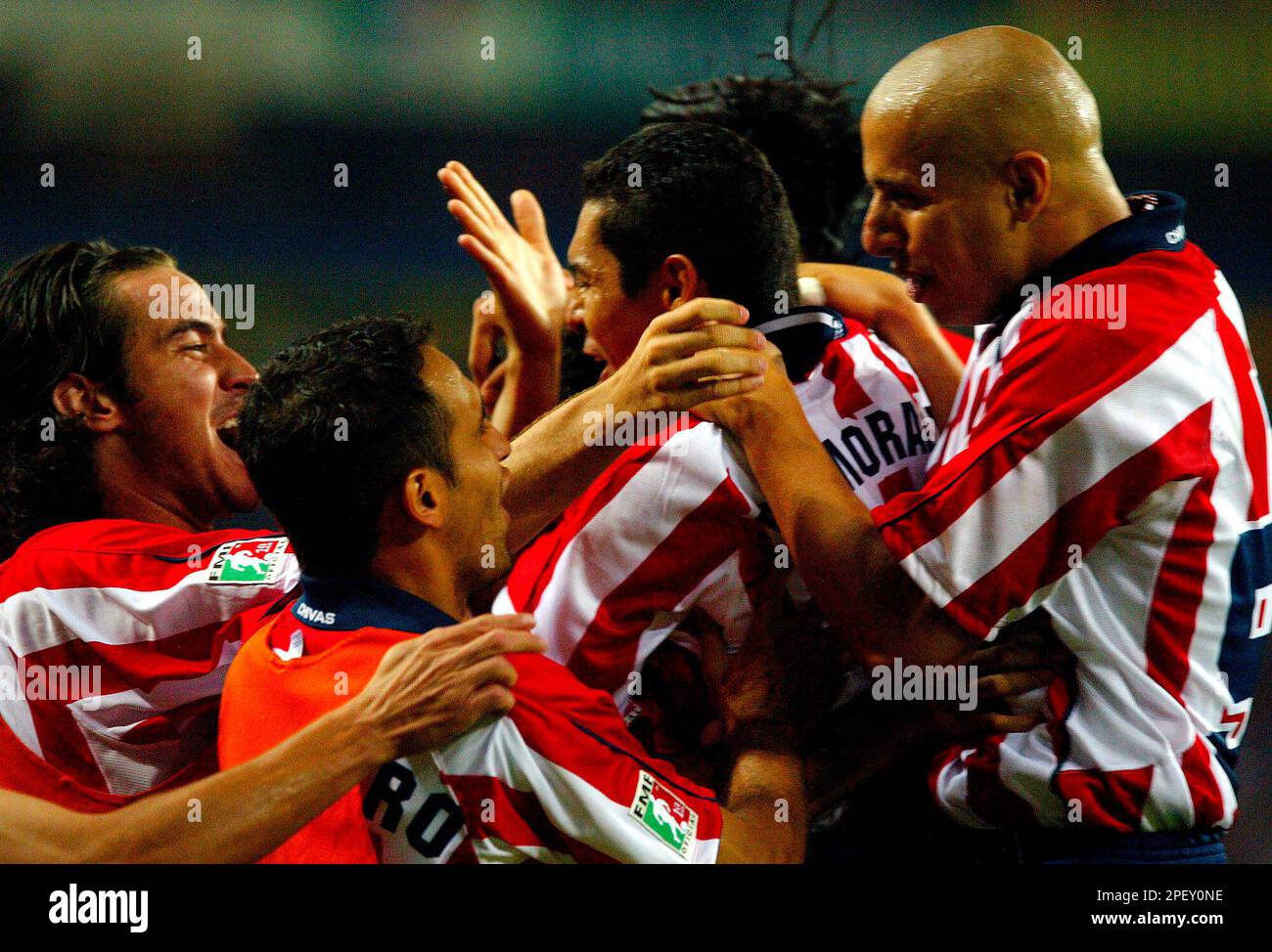 Chivas players celebrate after scoring their first goal against Toluca ...
