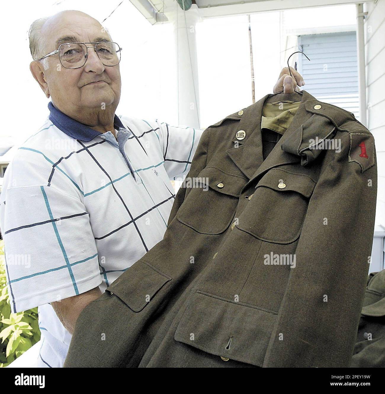 D-Day Veteran Michael Hubiack shows off his Army issued 38 regular ...