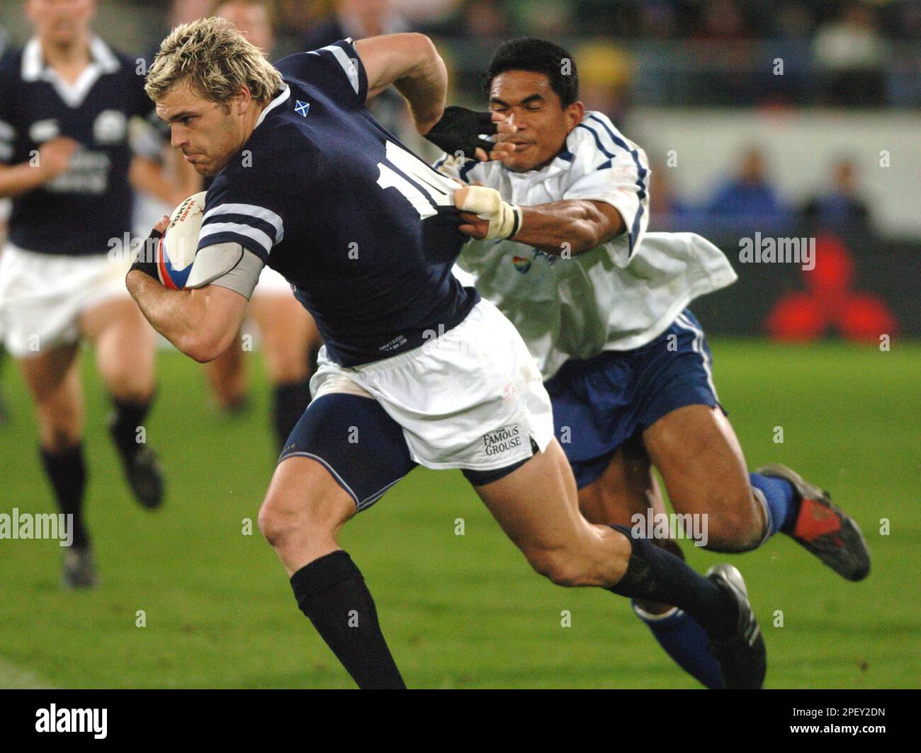 Scotland wing Sean Lamont runs through the tackle of Samoan captain ...